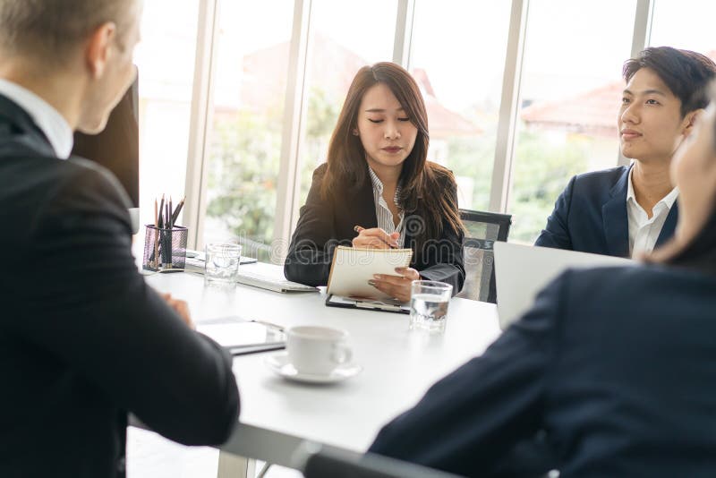 Close Up Group of Employees Meeting and Discussing in Conference Room ...