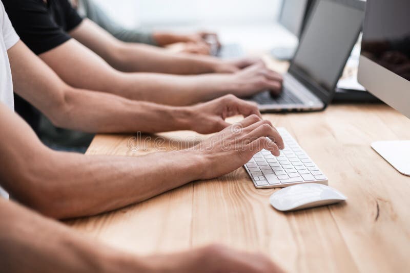 Close Up. a Group of Employees Work on Their Computers Stock Photo ...