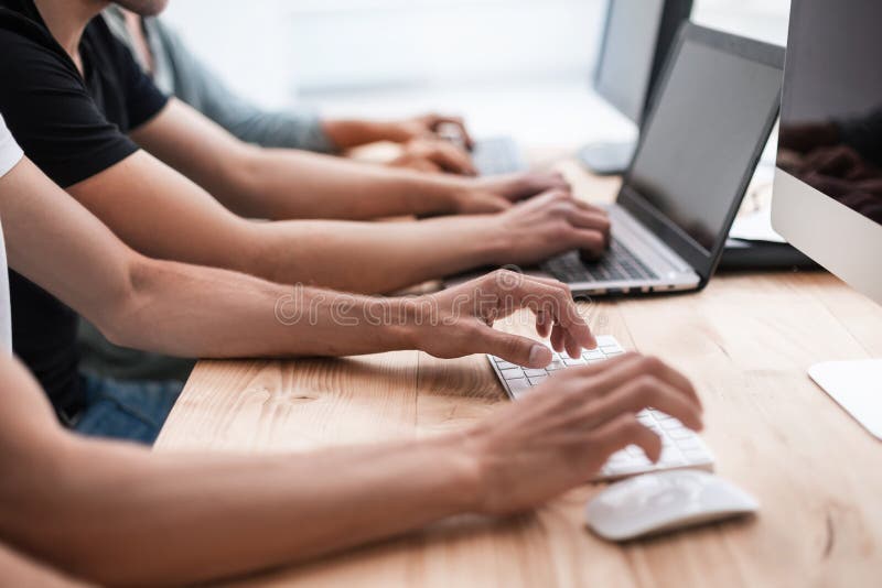 Close Up. a Group of Employees Work on Their Computers Stock Image ...