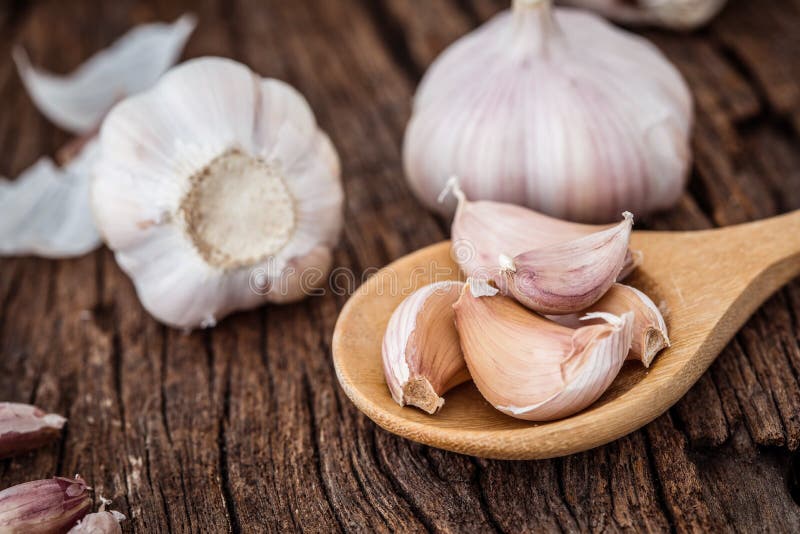 Close Up Group of Garlic on Kitchen Wooden Table Stock Photo - Image of ...