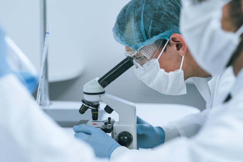 Close Up. Group of Scientists Conducts Testing in the Laboratory Stock ... Close Up. Group of Scientists Conducts Testing in the Laboratory Stock ...