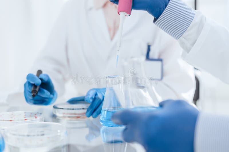 Close Up. Group of Scientists Microbiologists Working in the Laboratory ...