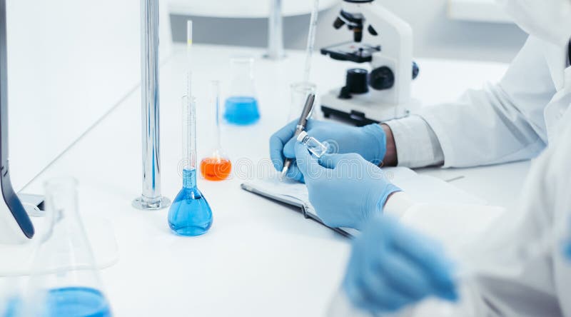 Close Up. Group of Scientists Sitting at a Laboratory Table Stock Image ...