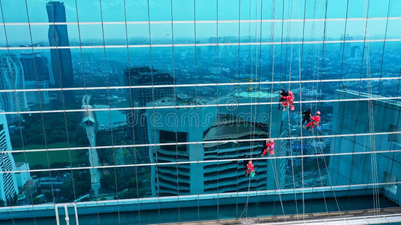 Close Up Group of Workers Cleaning Turquoise Blue Windows Service on ...