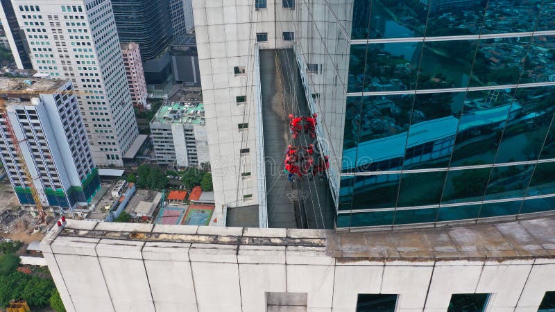 Close Up Group of Workers Cleaning Windows Service on High Rise ...
