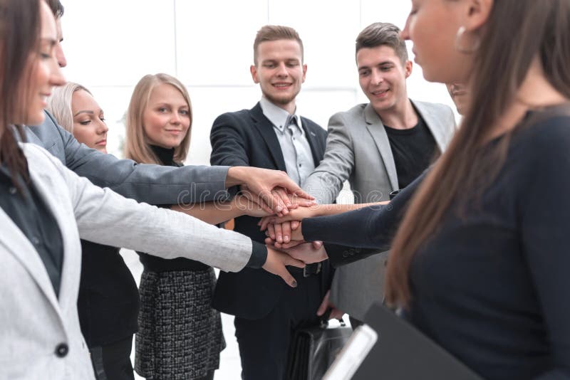 Close Up. Group of Young Employees Standing in a Circle Stock Image ...