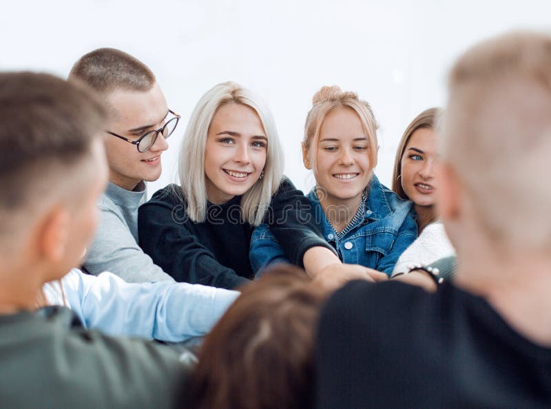 Close Up. a Group of Young People Joining Their Palms in a Pile Stock ...