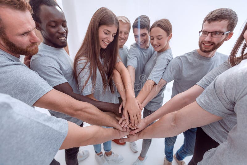 Close Up. a Group of Young People Showing Their Unity Stock Photo ...