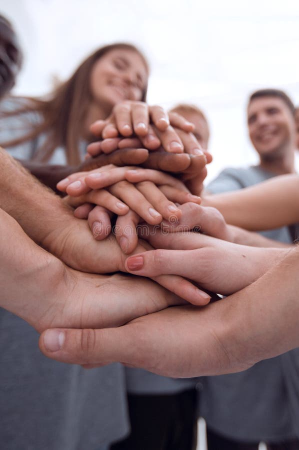 Close Up. a Group of Young People Showing Their Unity Stock Photo ...