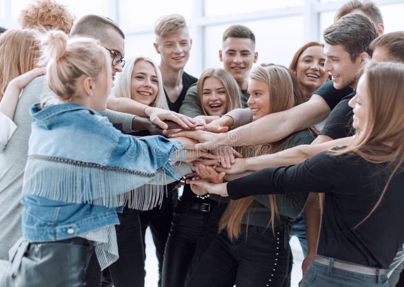 Close Up. a Group of Young People Showing Their Unity Stock Photo ...