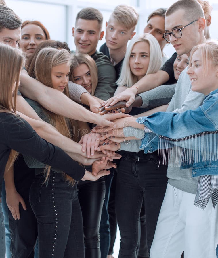 Close Up. a Group of Young People Showing Their Unity Stock Photo ...