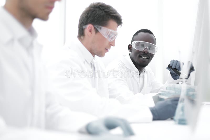 Close Up.a Group of Young Scientists in the Workplace Stock Photo ...
