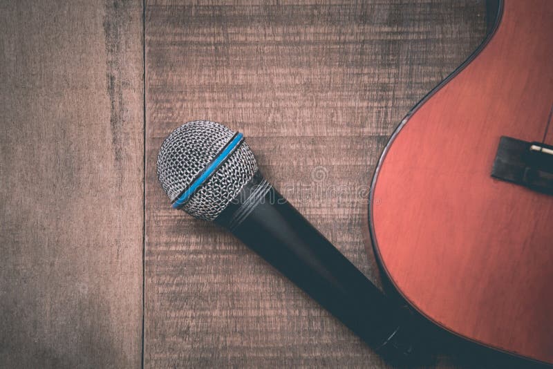 Close-up of Grunge Ukulele and Microphone on Wooden Background Stock ...