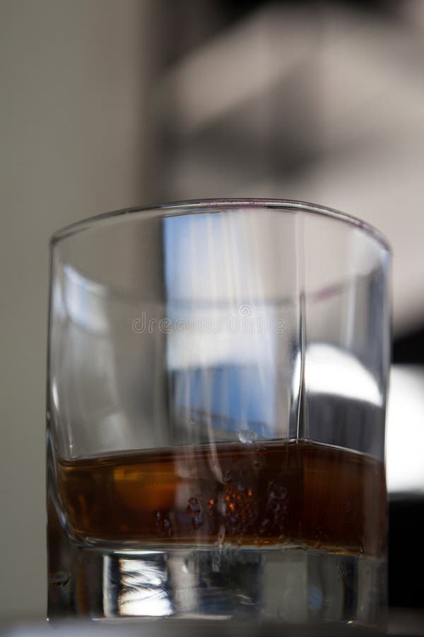 Close Up of Half Filled Alcohol Glass Stock Photo - Image of still ...