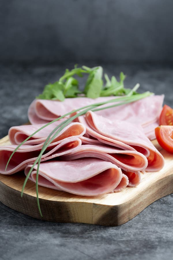 Close Up Ham Slices Isolated on Cutting Board Over Dark Background ...