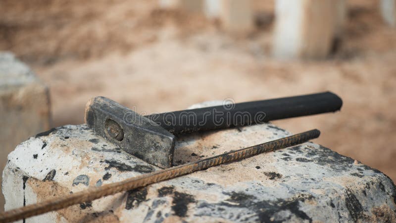 A Close-up of a Hammer Striking a Rock, Creating a Dynamic and Powerful ...