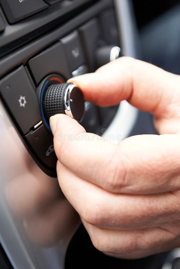 Close Up of Hand Adjusting Car Air Conditioning Control on Dashboard ...