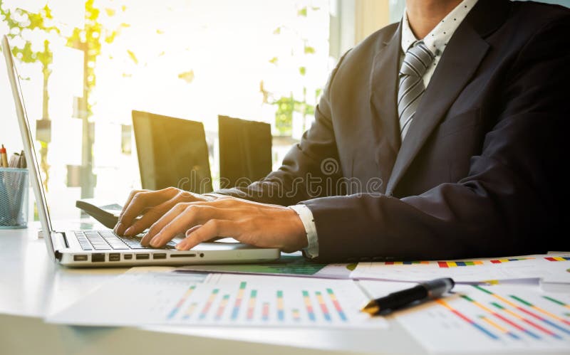 Close Up of Hand of Business Man Working Document and Laptop in Stock ...