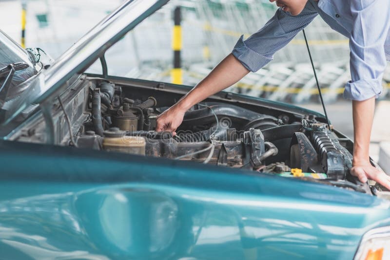 Hand checking car engine stock photo. Image of holding - 145976168