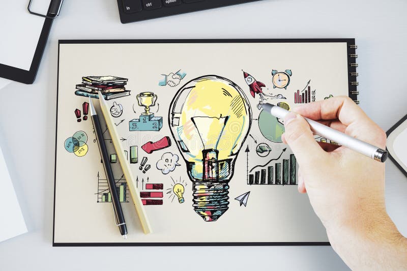 Close Up of Hand Drawing Creative Light Bulb Sketch on Desk. Idea and ...
