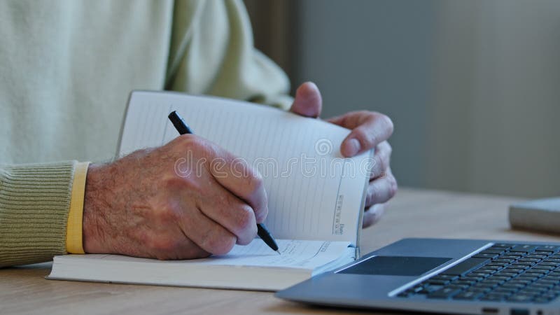 Close-up Hand of Elderly Caucasian Man Write Notes in Personal Paper ...