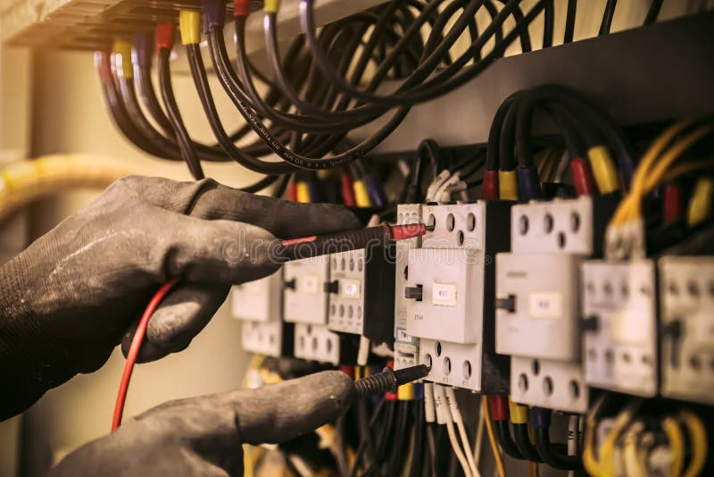 Close-up Hand of Electrical Engineer Using Measuring Equipment To ...