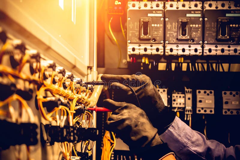 Close-up Hand of Electrical Engineer Using Measuring Equipment To ...