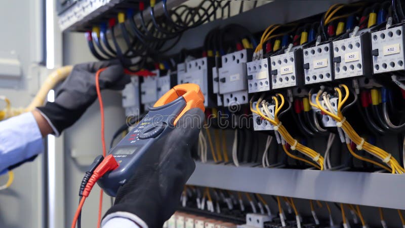 Close-up Hand of Electrical Engineering Using Measuring Equipment Tool ...