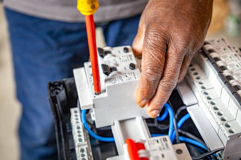 Close-up Hand of a Electrician Working on a Industrial Panel Mounting ...