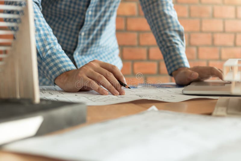 Close Up Hand Engineering Man Standing Examining Working on Blue Stock ...