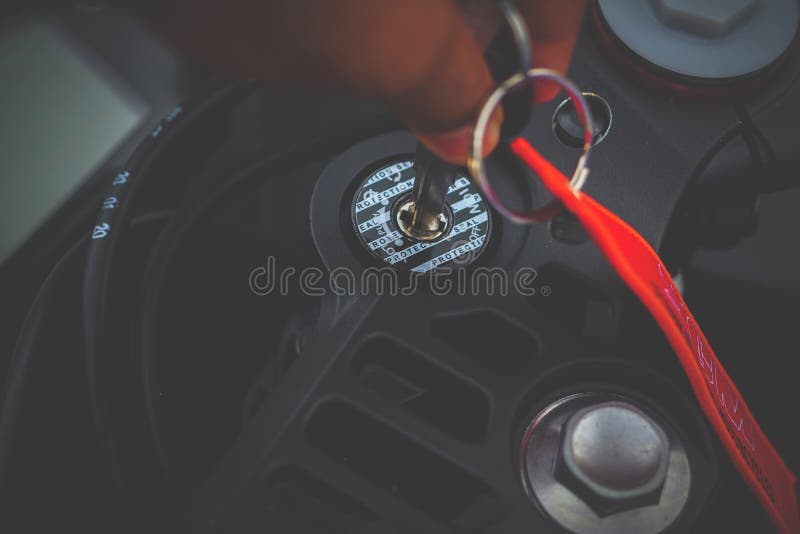 Close Up Hand Enter Motorcycle Key To Start the Engine. Stock Image ...