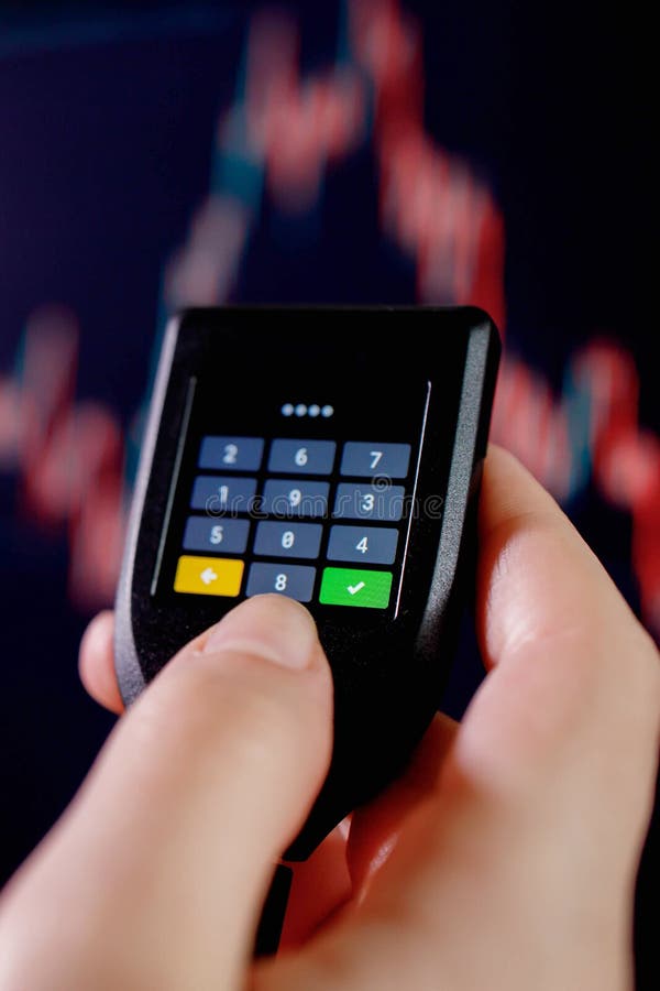 Close Up Hand Enter the Password on Cryptocurrencey Hardware Cold ...