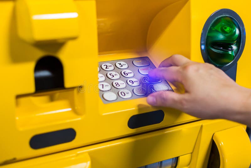 Finger about To Press a Pin Code on a Pad. Security Code on an Yellow ...