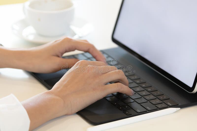 Close Up of Hand and Fingers Typing or Working with Digital Tablet or ...