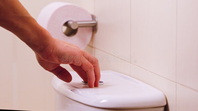 Hand Flushing a Toilet in a Bathroom Stock Photo - Image of home ...