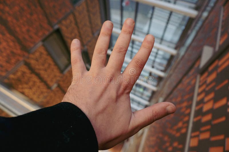 Close Up of a Hand Gestures Inside a Building Stock Photo - Image of ...