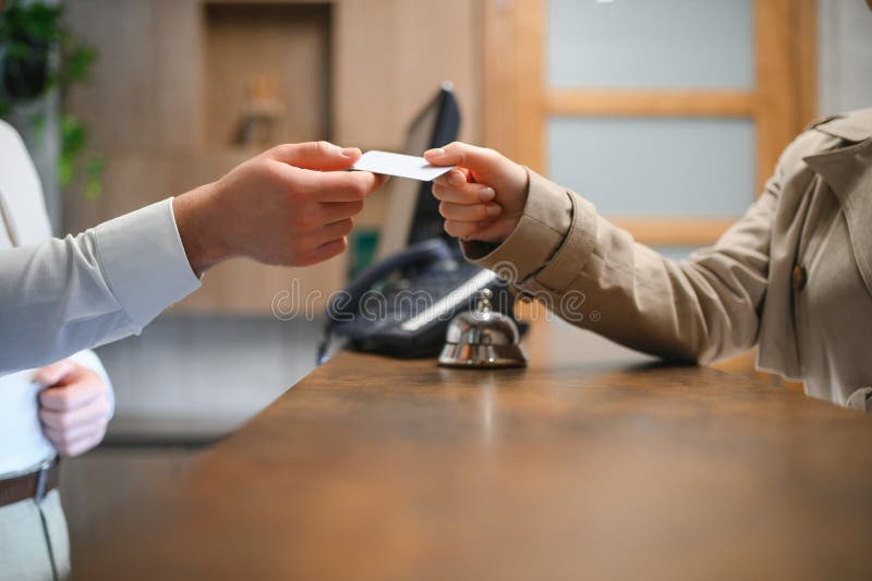 Close Up of Hand Guest Takes Room Key at Check-in Desk of the Hotel ...
