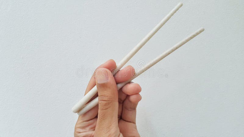 Close Up of Hand Holding Chopsticks on White Background Stock Image ...