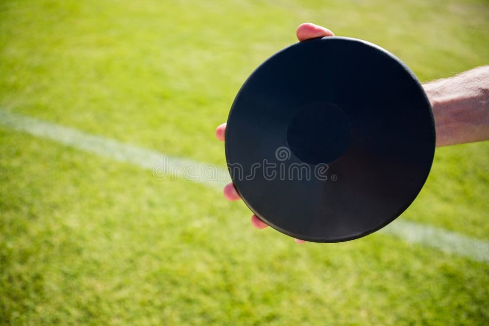 Close-up of Hand Holding a Discus Stock Image - Image of holding ...