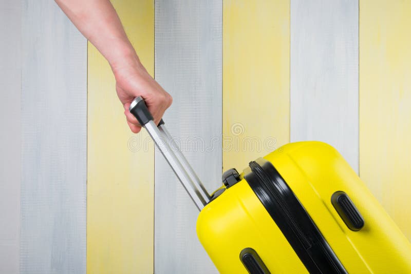 Close-up of a Hand Holding the Handle of a Travel Suitcase Stock Image ...