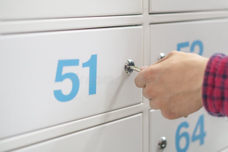 Close Up Hand Holding the Key Opens the Bank Box Safe D Stock Photo ...
