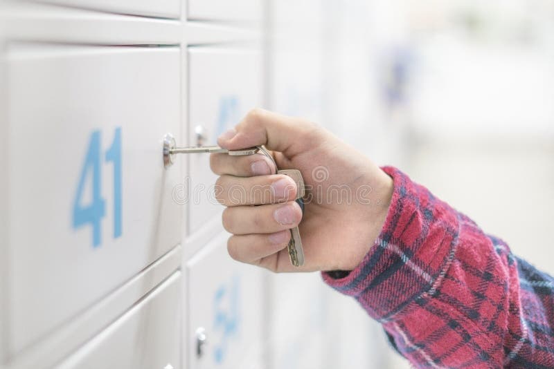 Close Up Hand Holding the Key Opens the Bank Box Safe D Stock Photo ...