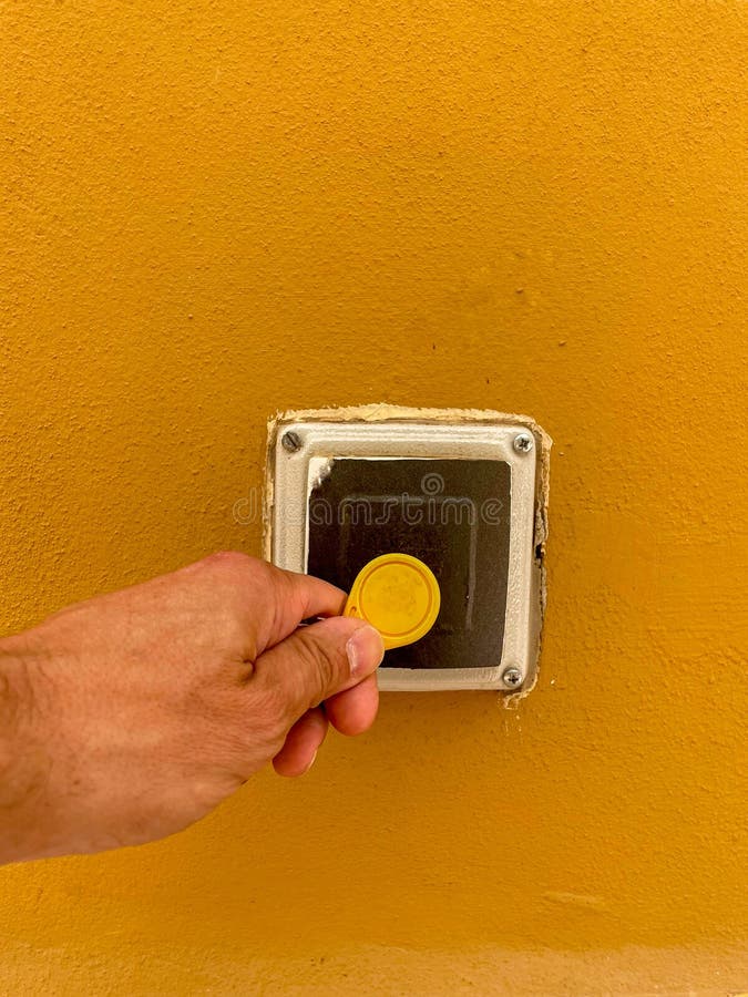 Close-up of a Hand Holding a Magnetic Key on the Sensor of a Door To ...