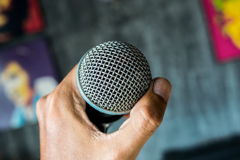Close Up Hand Holding Microphone on Music Hall Stock Photo - Image of ...