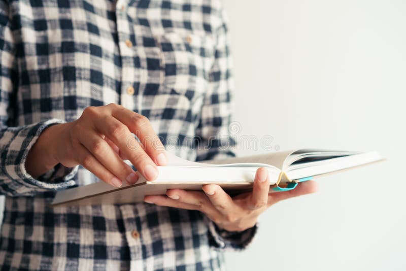 Close Up Hand Holding , Open and Reading a Book. Study is a Learning ...