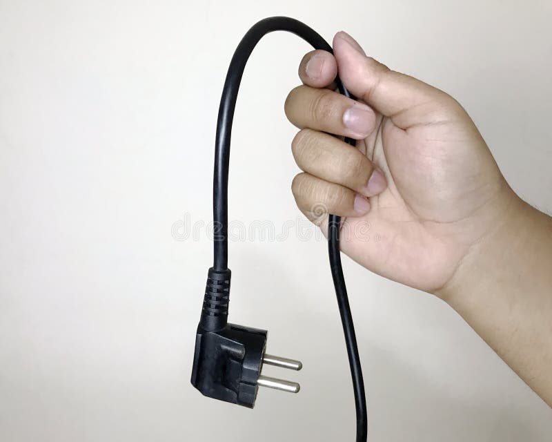 A Close Up of a Hand Holding the Power Cable Stock Image - Image of ...
