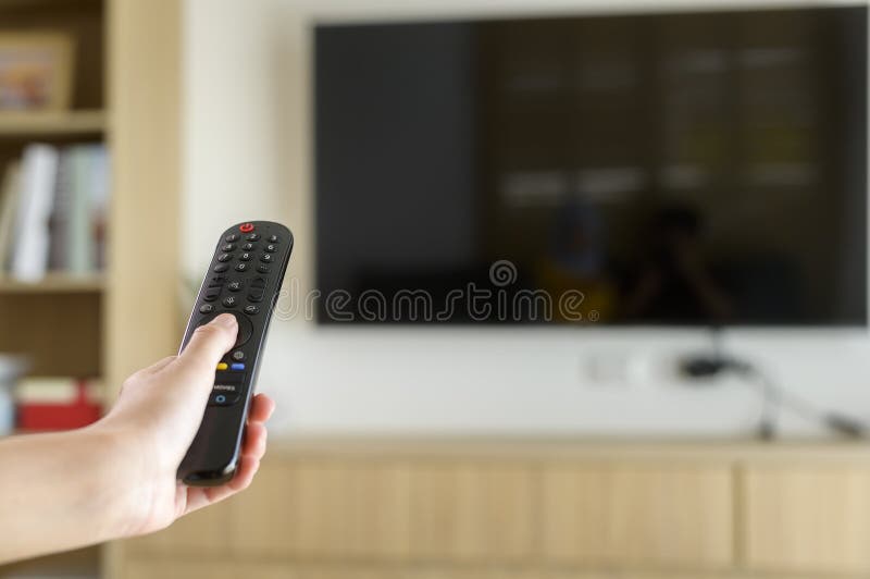 Close Up of Hand Holding Tv Remote Controller Stock Image - Image of ...