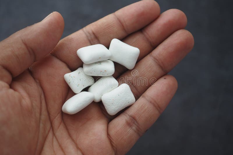 Close-Up of Hand Holding White Chewing Gum Pieces Stock Image - Image ...