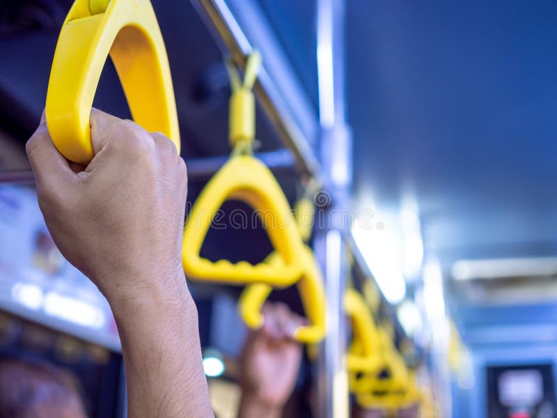 Close-up Hand Holding Yellow Handle in the Bus Stock Photo - Image of ...