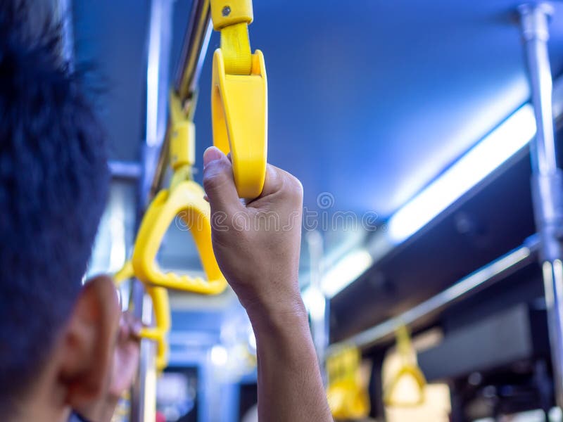 Close-up Hand Holding Yellow Handle in the Bus Stock Image - Image of ...
